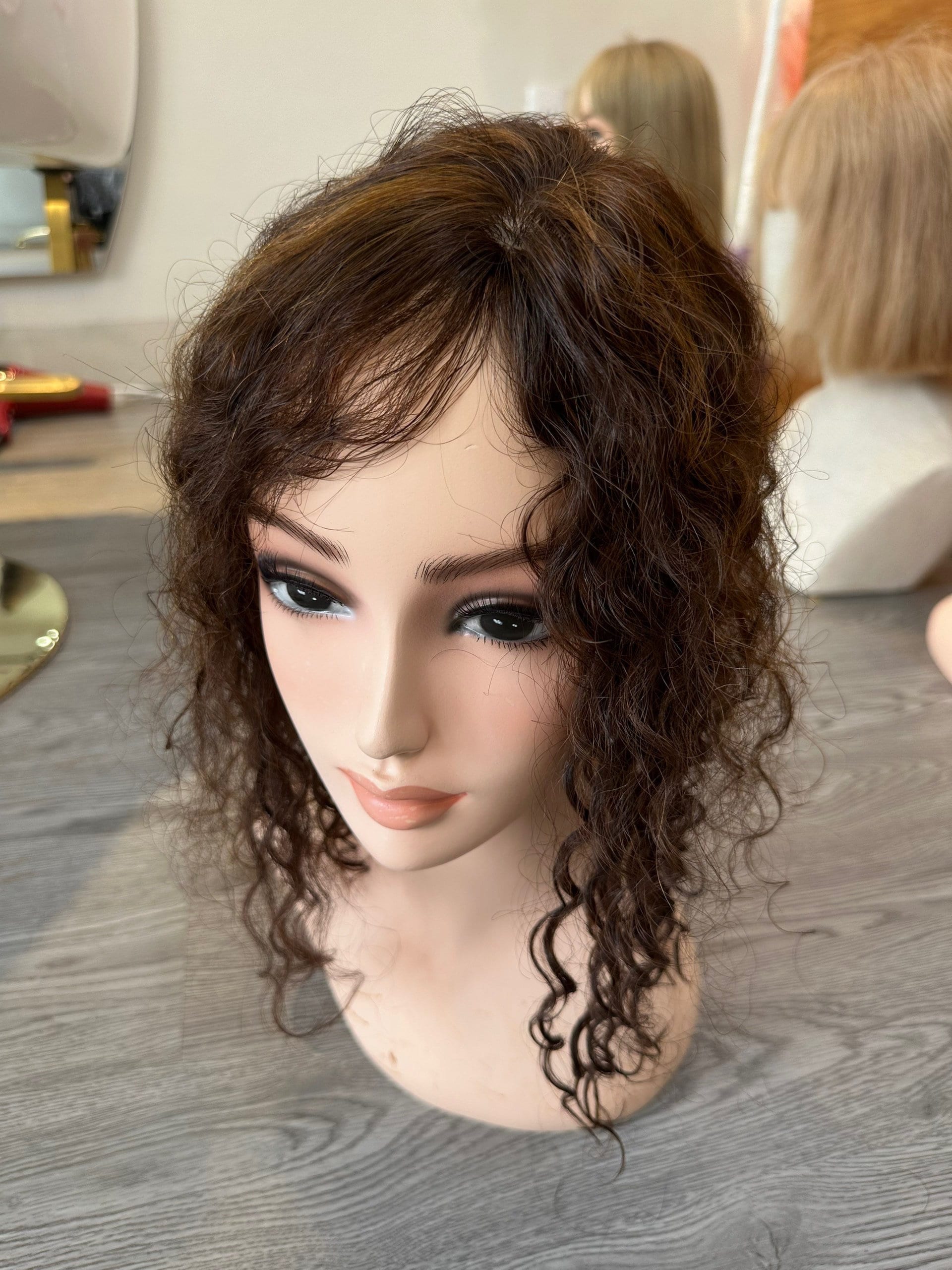 Lavia, medium density chocolate brown plus light brown highlights huma ...